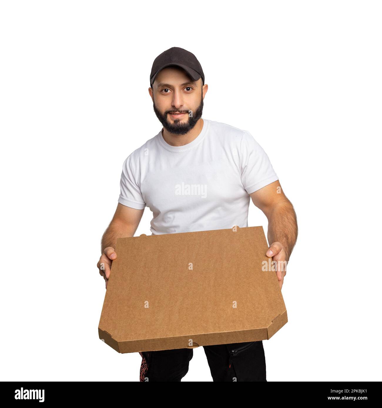 Young delivery man smiling while posing with pizza box isolated over ...