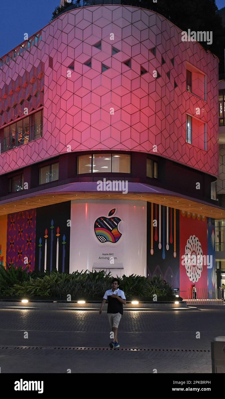 A man walks near soon to be launched Apple's first company owned store ...