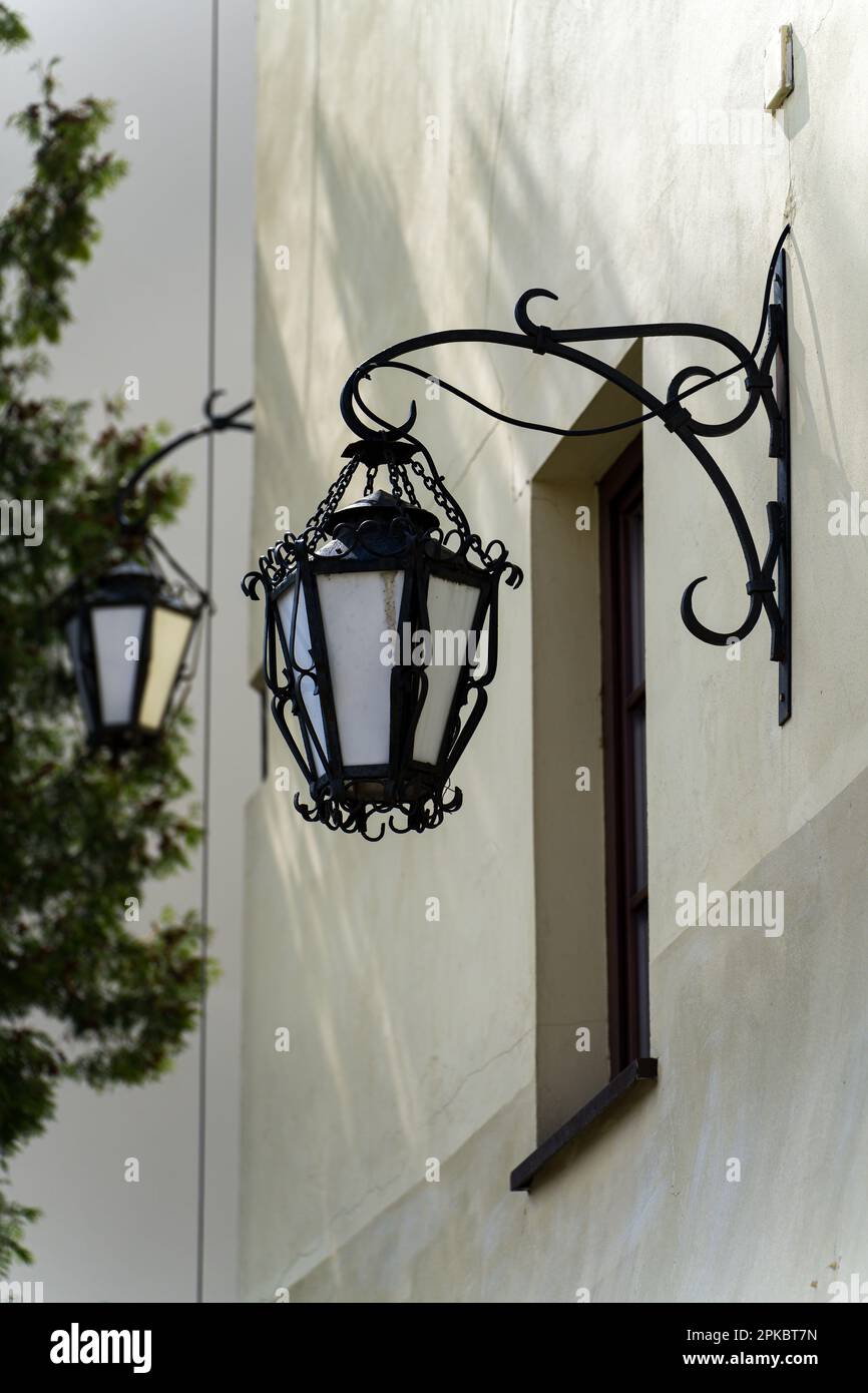Historic lantern on the wall of a tenement house Stock Photo - Alamy