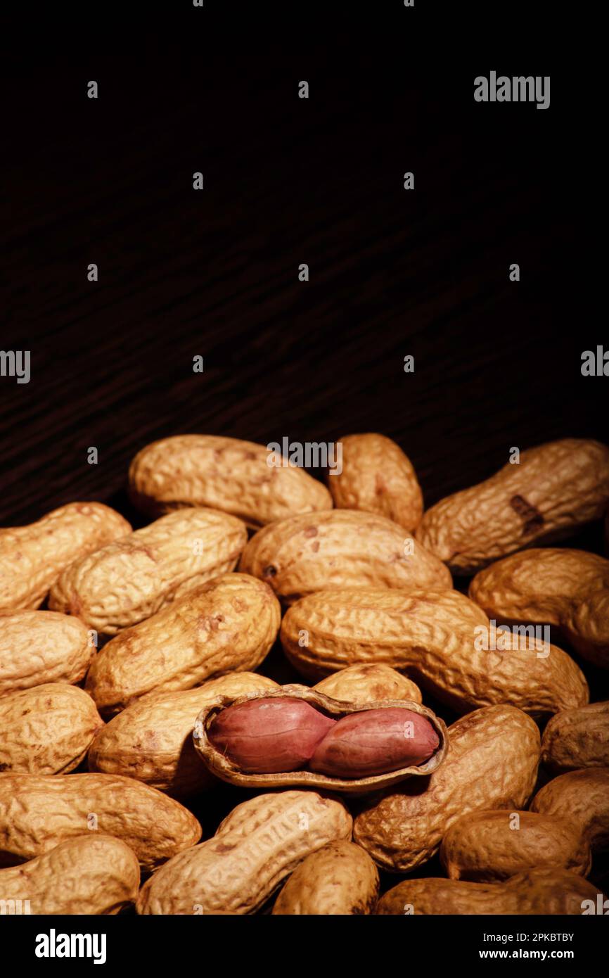 Roasted peanut with shell on table Stock Photo - Alamy