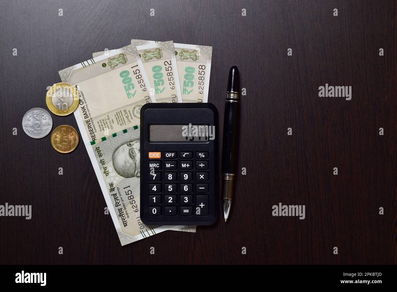 Top view of indian rupee with caluclator and pen Stock Photo - Alamy