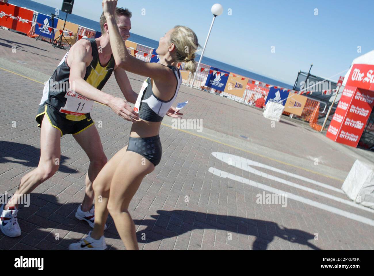 New Zealand’s Jessica Ruthe, winner of the women’s race, embraces her ...