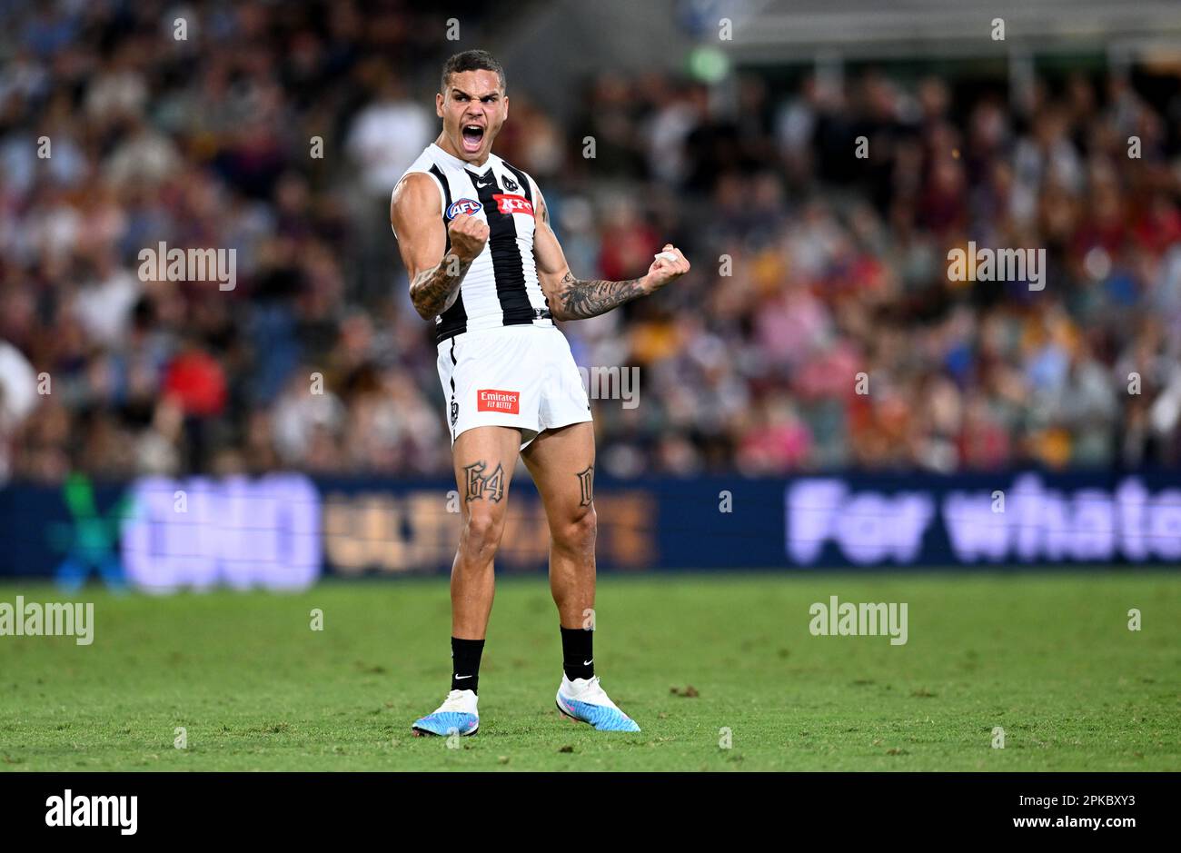 Bobby Hill of the Magpies celebrates kicking a goal during the AFL ...