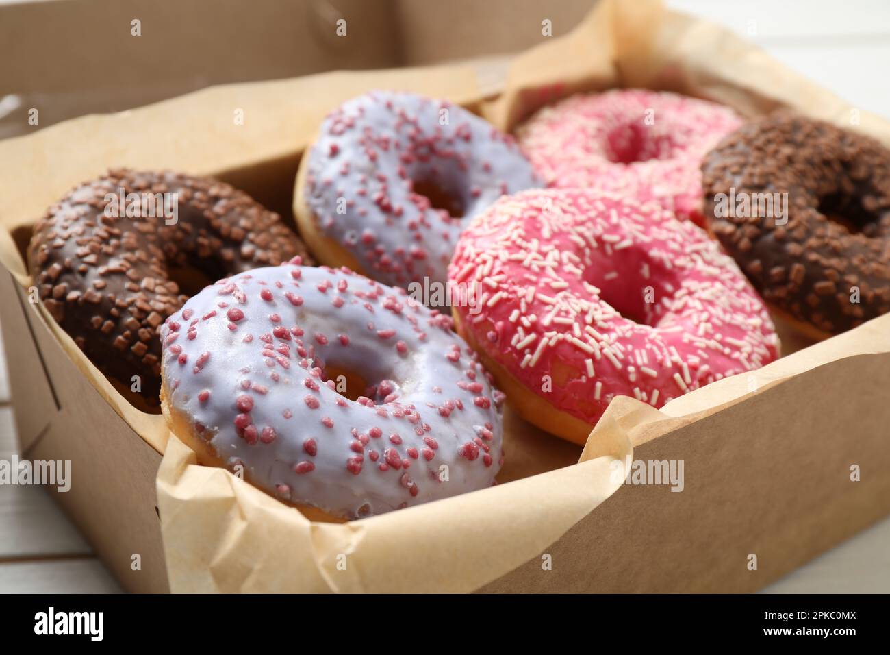 Sweet delicious glazed donuts in box, closeup Stock Photo - Alamy