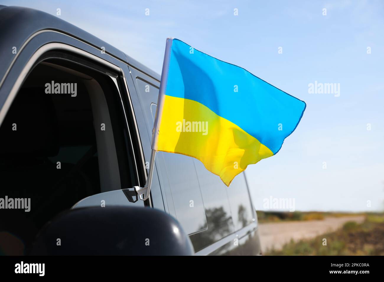 National flag of Ukraine on car window outdoors, closeup Stock Photo ...