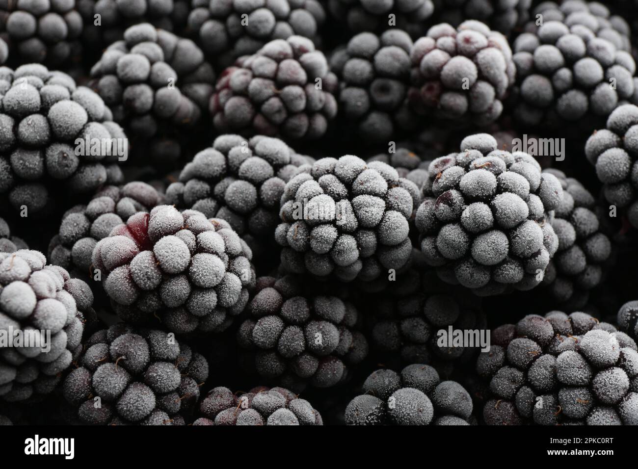 Tasty frozen blackberries as background, closeup view Stock Photo - Alamy