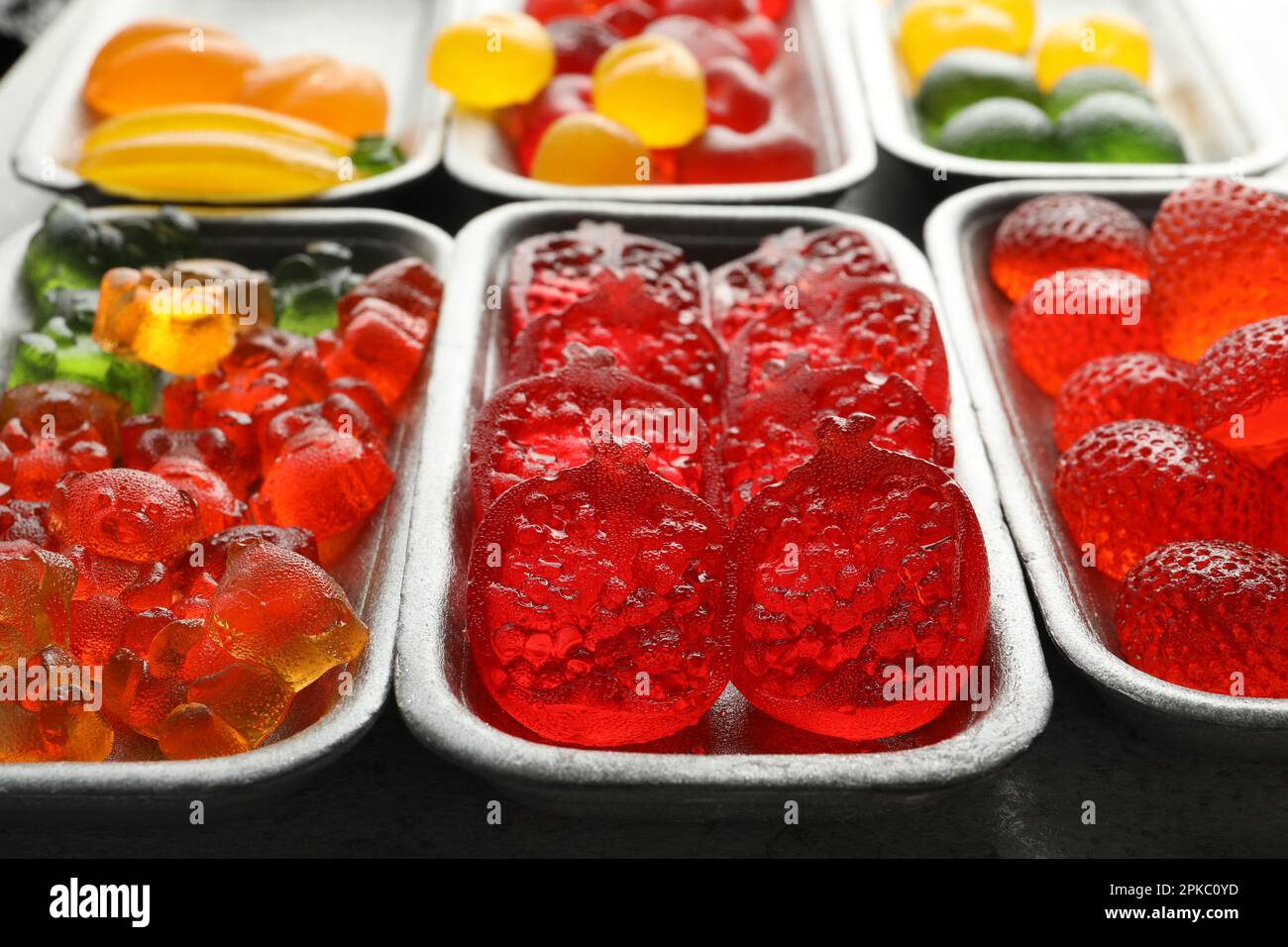 Different delicious gummy candies on grey table, closeup Stock Photo ...