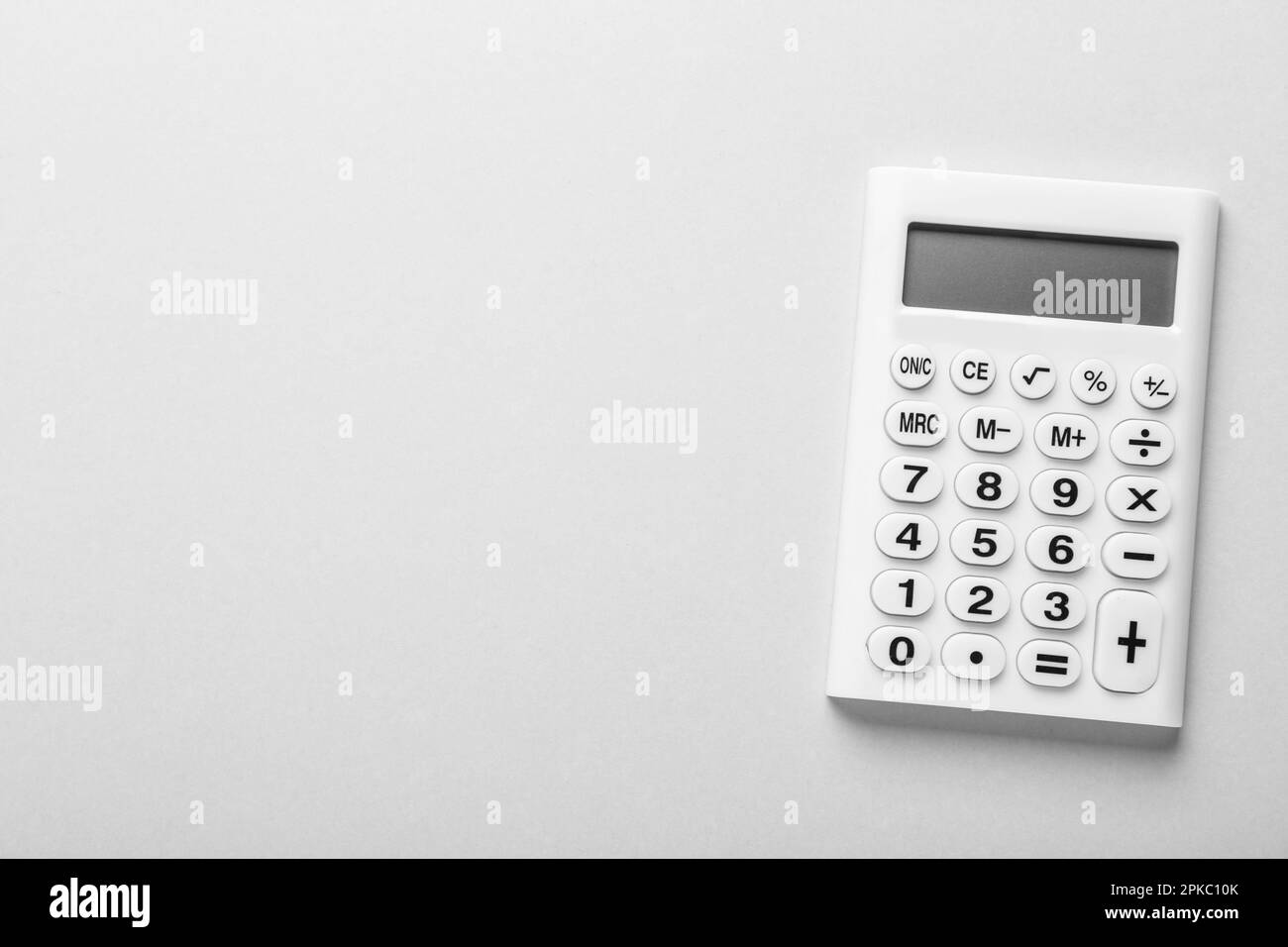 White calculator on light background, top view. Space for text Stock ...