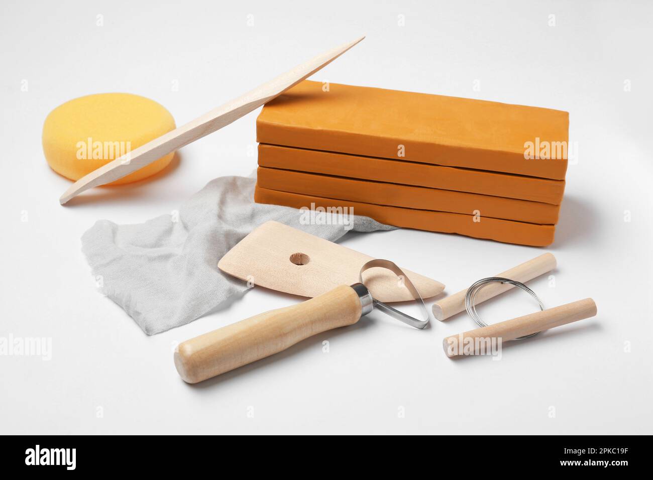 Clay and different modeling tools on white background Stock Photo - Alamy