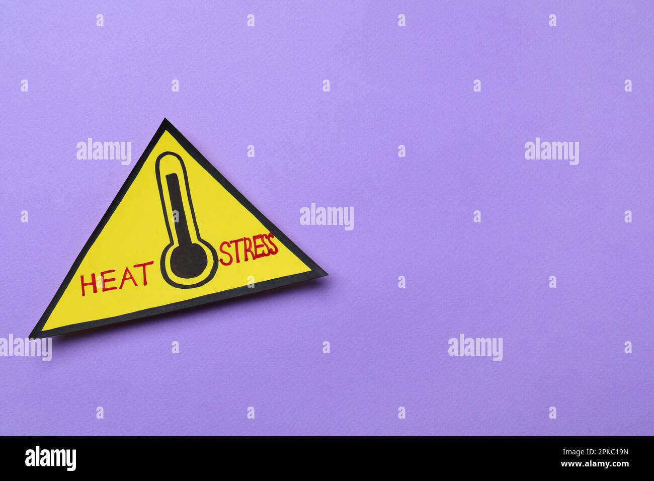 Yellow paper triangle with words Heat Stress and thermometer on violet ...