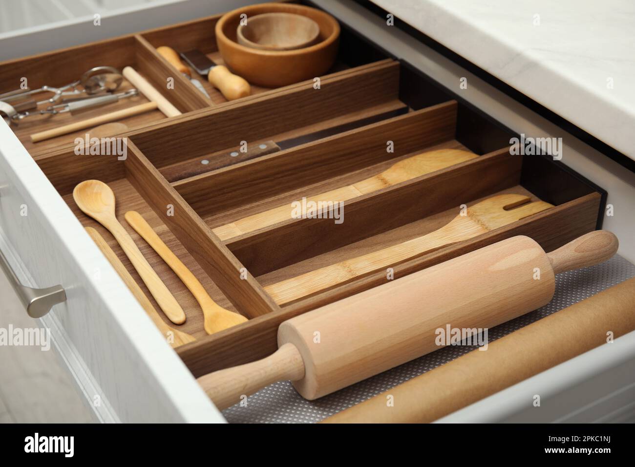 Open drawer of kitchen cabinet with different utensils, closeup Stock ...