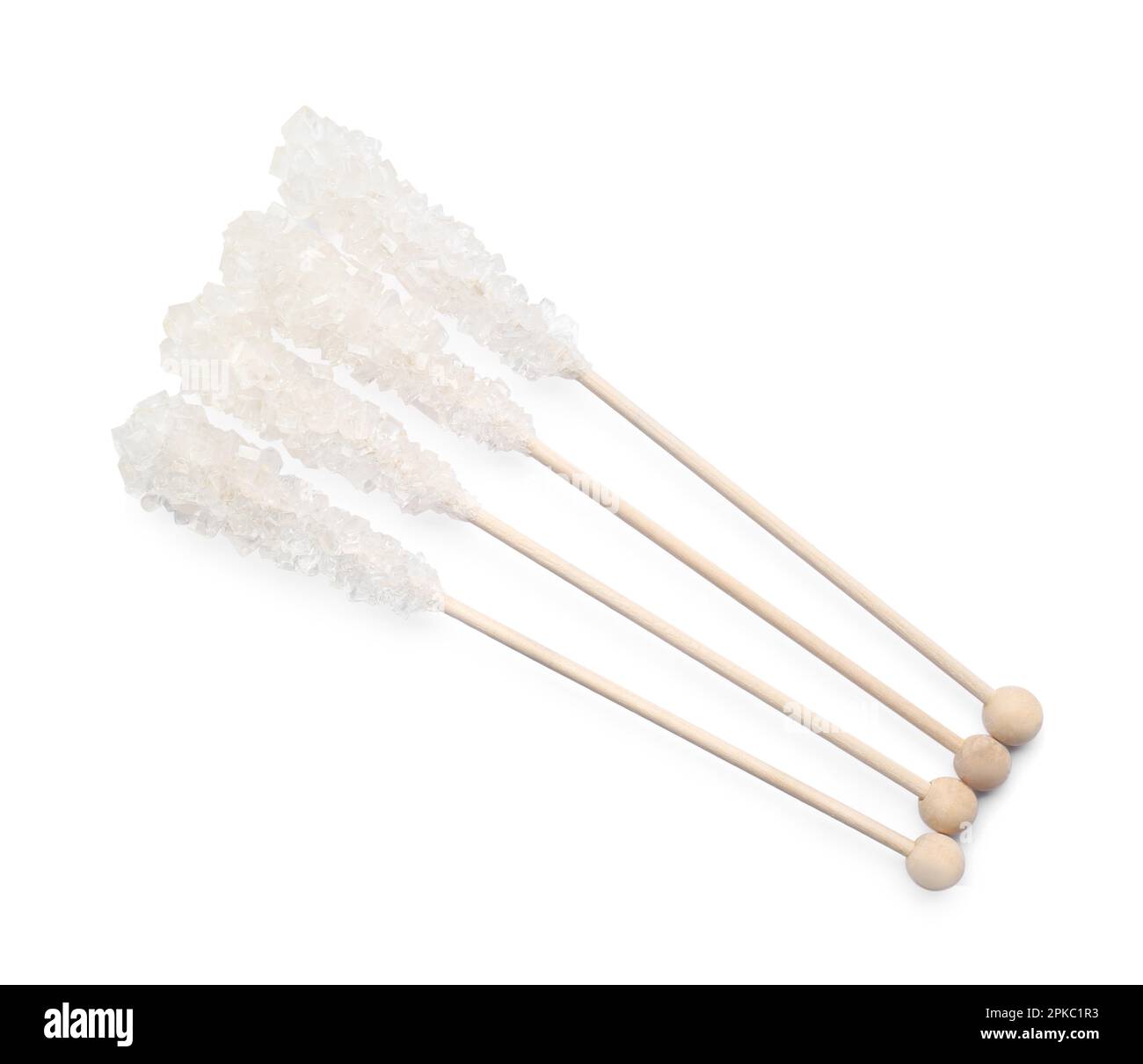 Wooden sticks with sugar crystals isolated on white, top view. Tasty ...