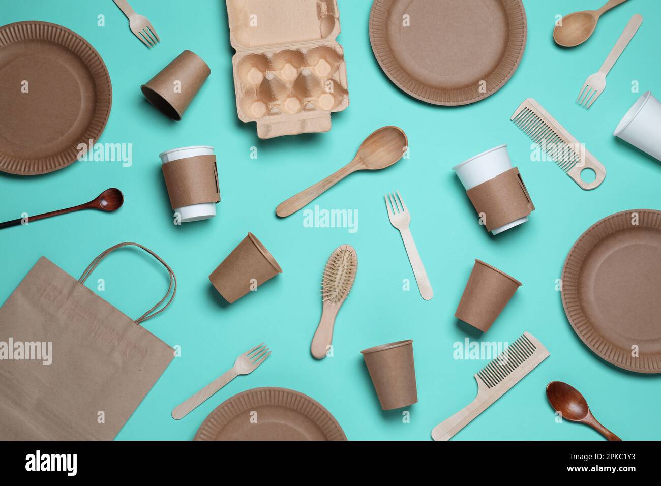 Different eco items on turquoise background, flat lay. Recycling ...