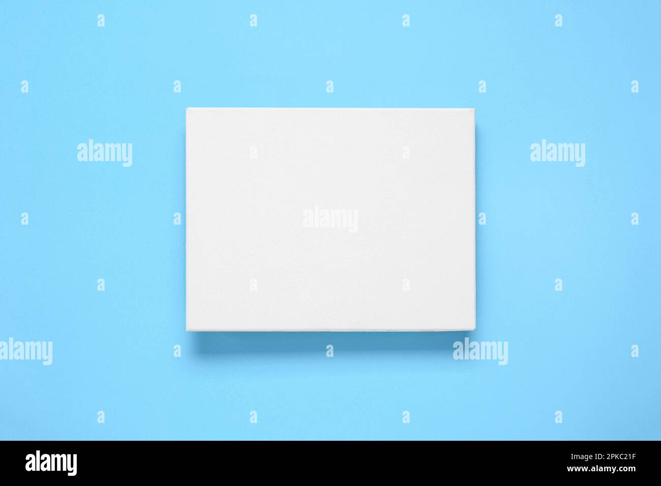 Blank canvas on light blue background, top view. Space for design Stock ...