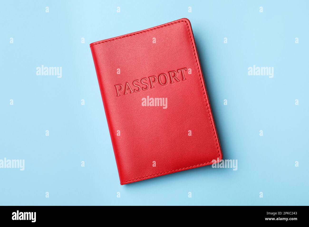 Passport in red leather case on light blue background, top view Stock ...