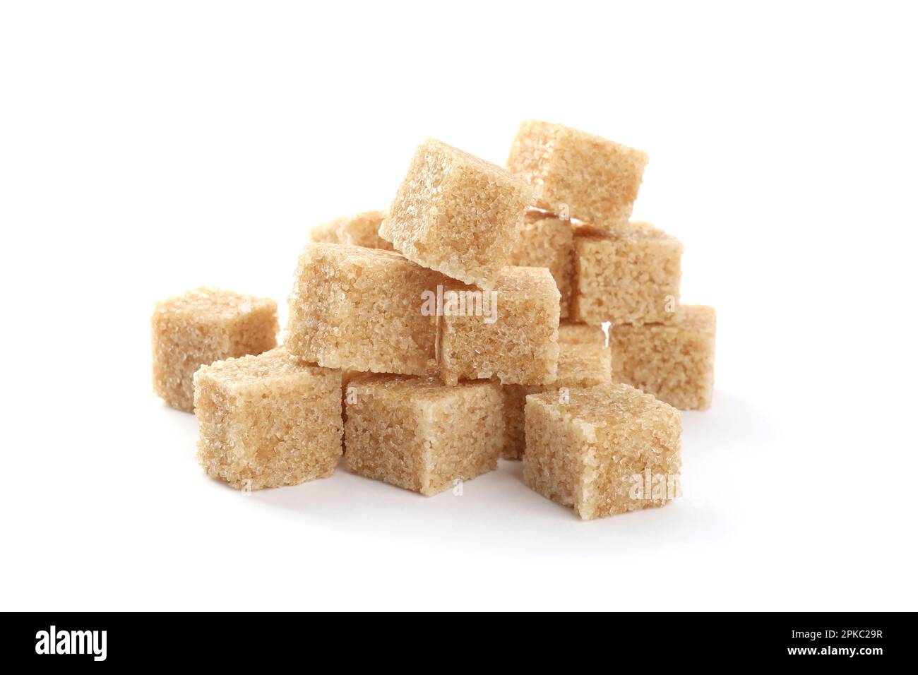 Pile of cubes with brown sugar on white background Stock Photo - Alamy