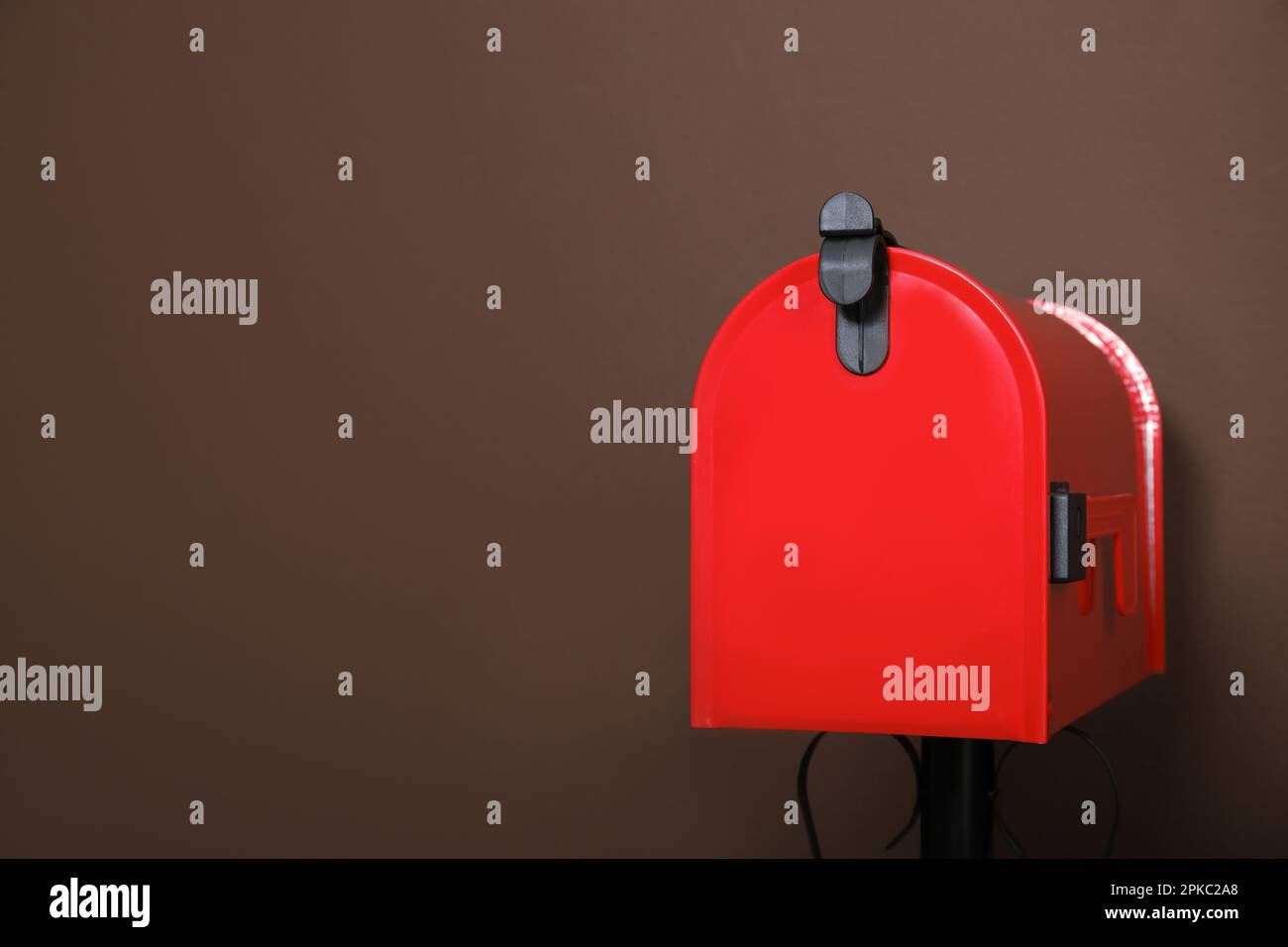 Closed red letter box against brown background. Space for text Stock ...