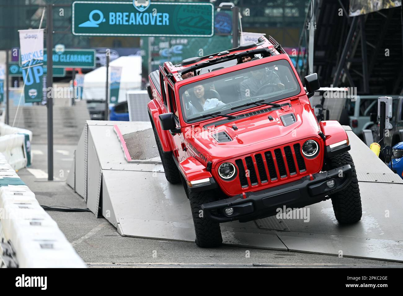 New York, USA. 06th Apr, 2023. People ride in a Jeep automobile through ...