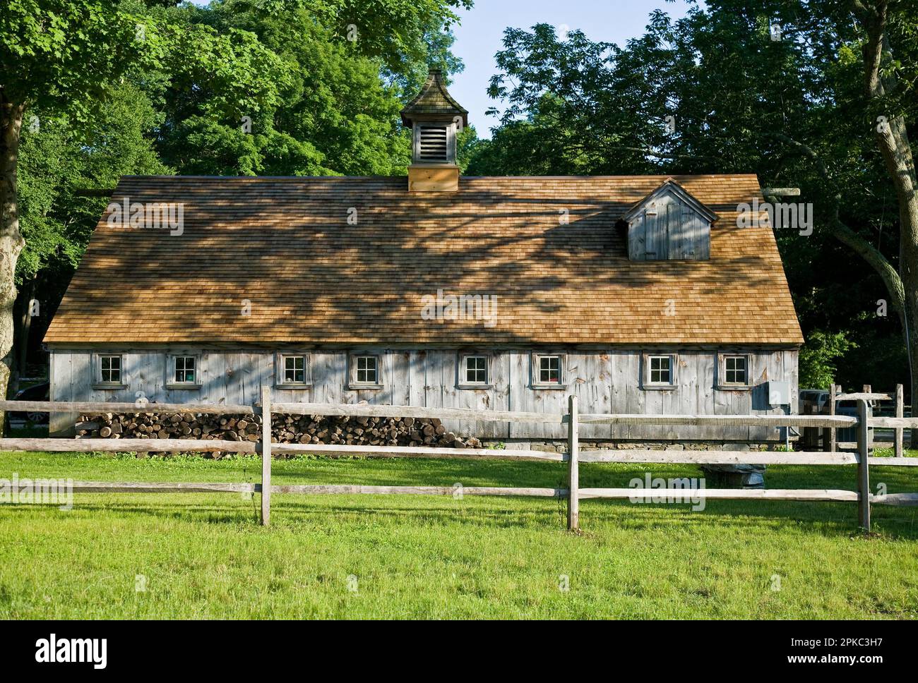 Restored barn with plank siding and cedar shingles and cupola ...