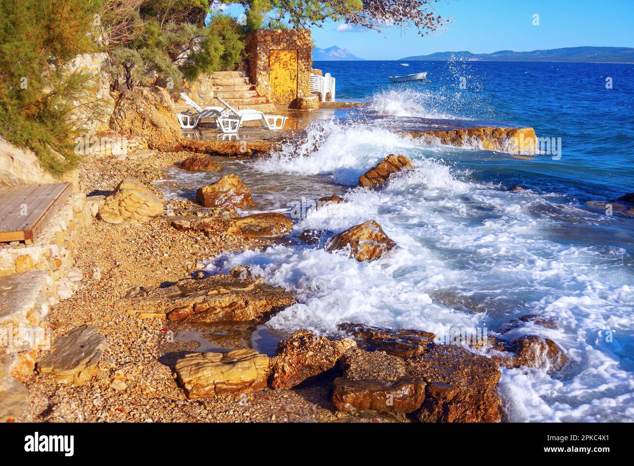 Awesome sea shore with waves and rocks in the water Stock Photo - Alamy