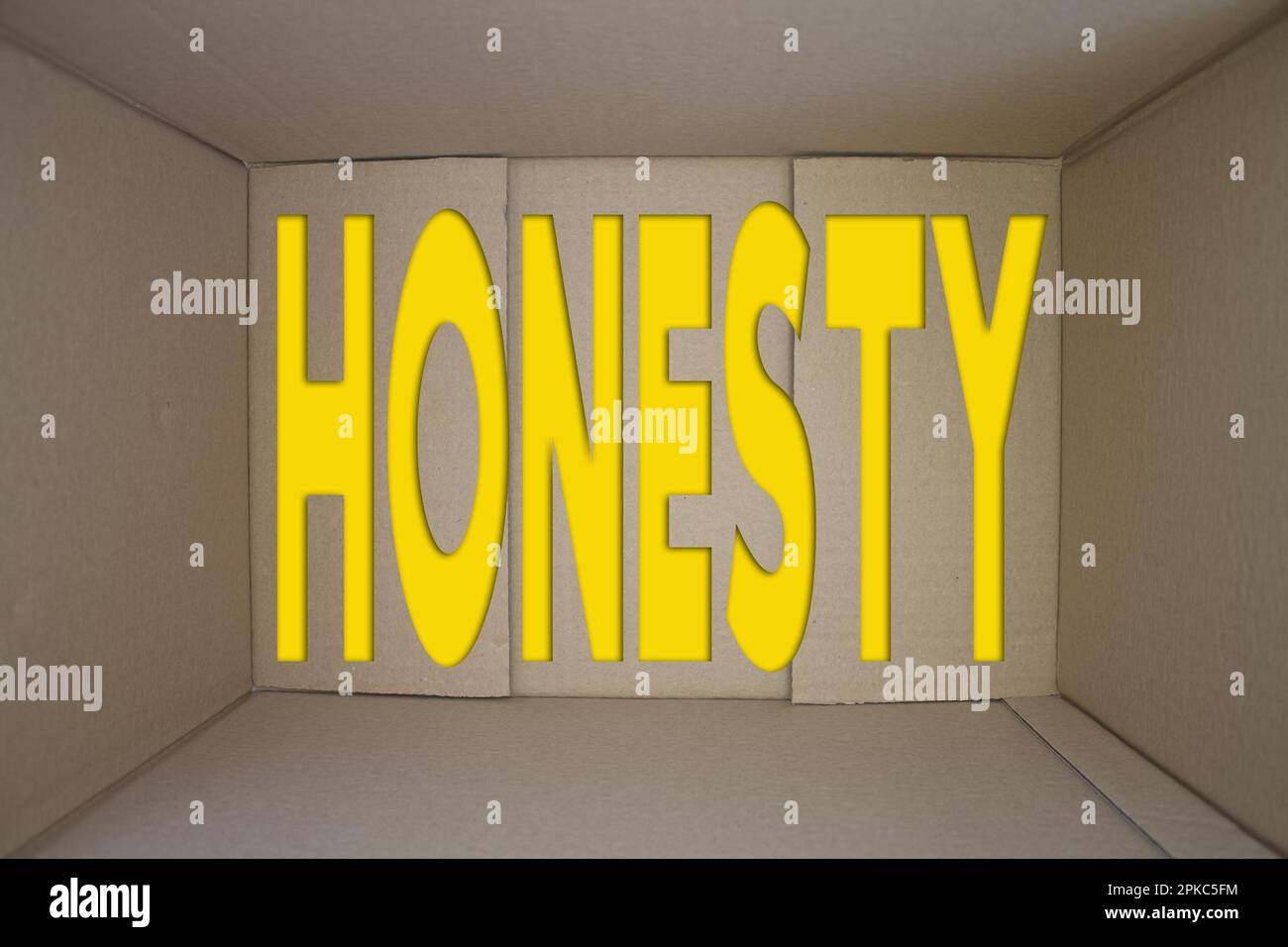 Honesty word with cardboard box. Brown folded card box Stock Photo - Alamy
