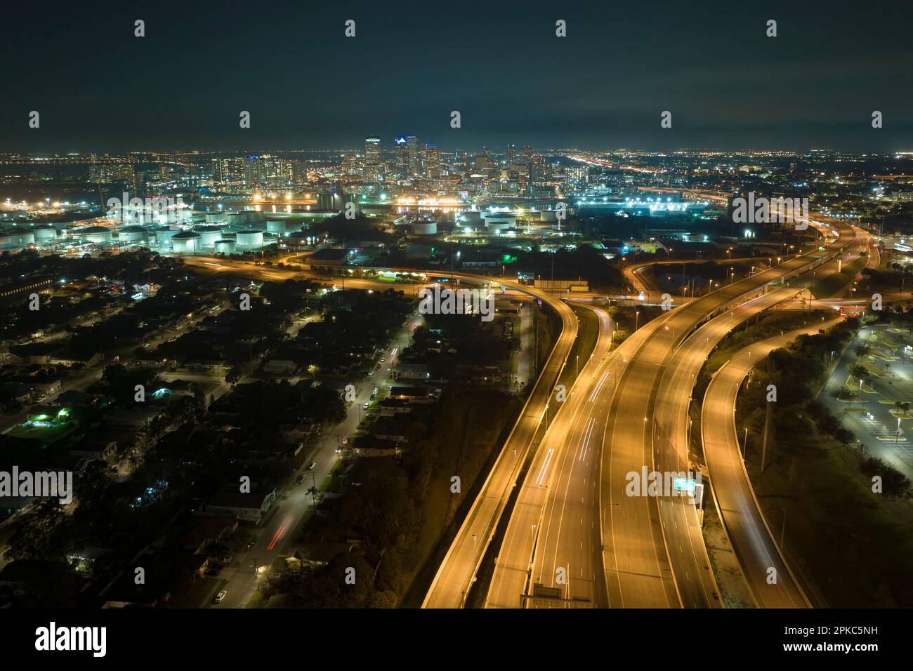 Aerial view of american highway junction at night with fast driving ...