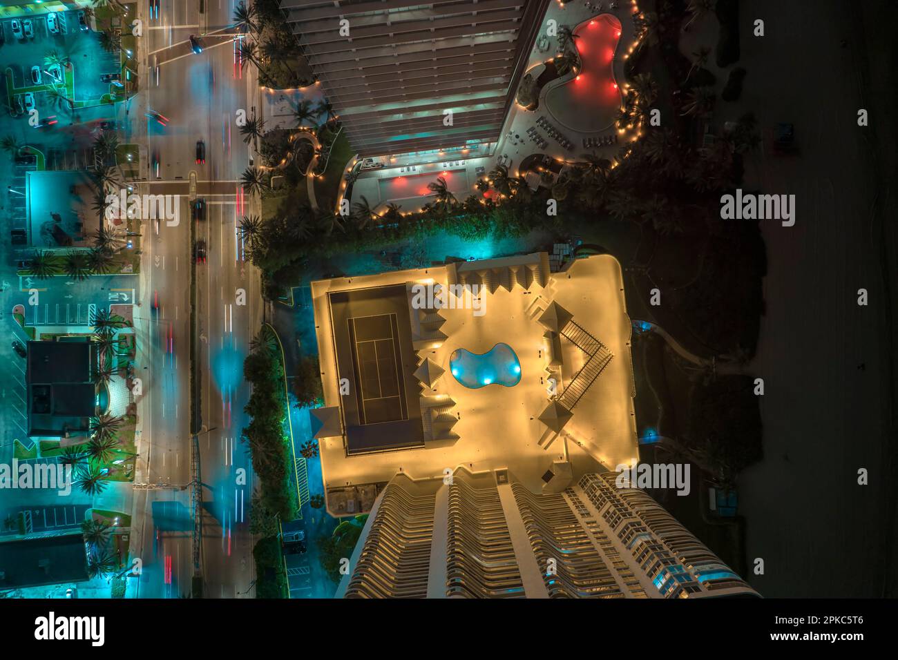 Aerial view of brightly illuminated high skyscraper hotel in downtown ...