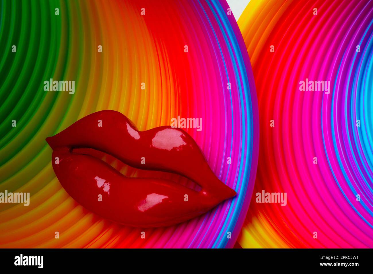 Red lips On Clorful Rings Abstract Still life Stock Photo - Alamy
