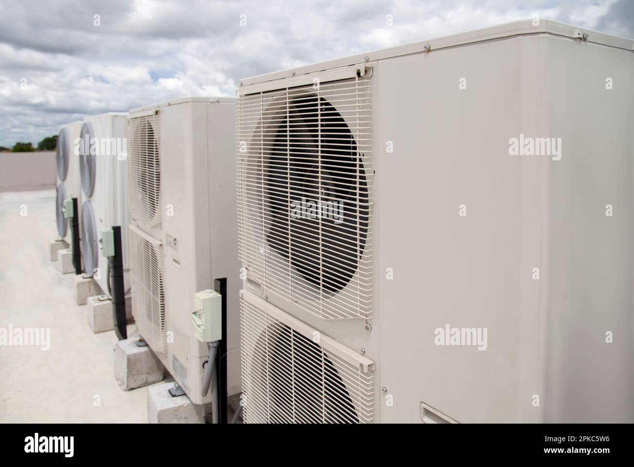 Air conditioning (HVAC) on the roof of an industrial building with blue ...