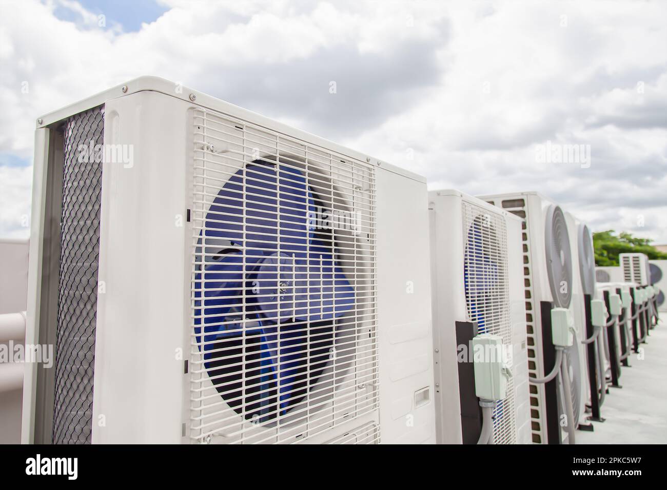 Air conditioning (HVAC) on the roof of an industrial building with blue ...