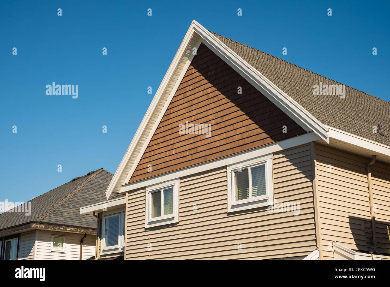 Facade of a house with nice windows in the blue sky background ...