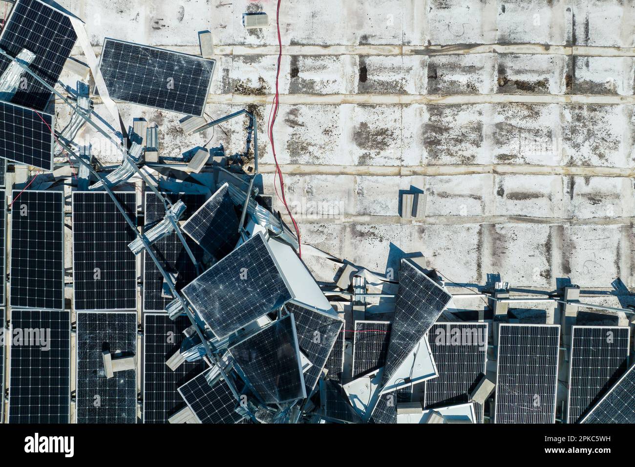 Aerial view of damaged by hurricane wind photovoltaic solar panels ...