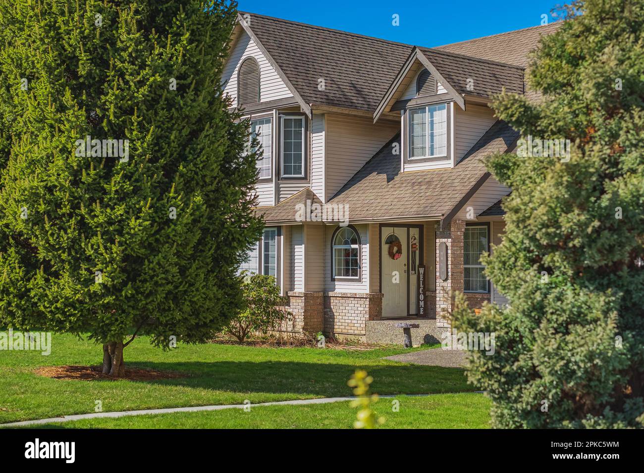 Real Estate Exterior Front House on a sunny day. Big custom made luxury ...