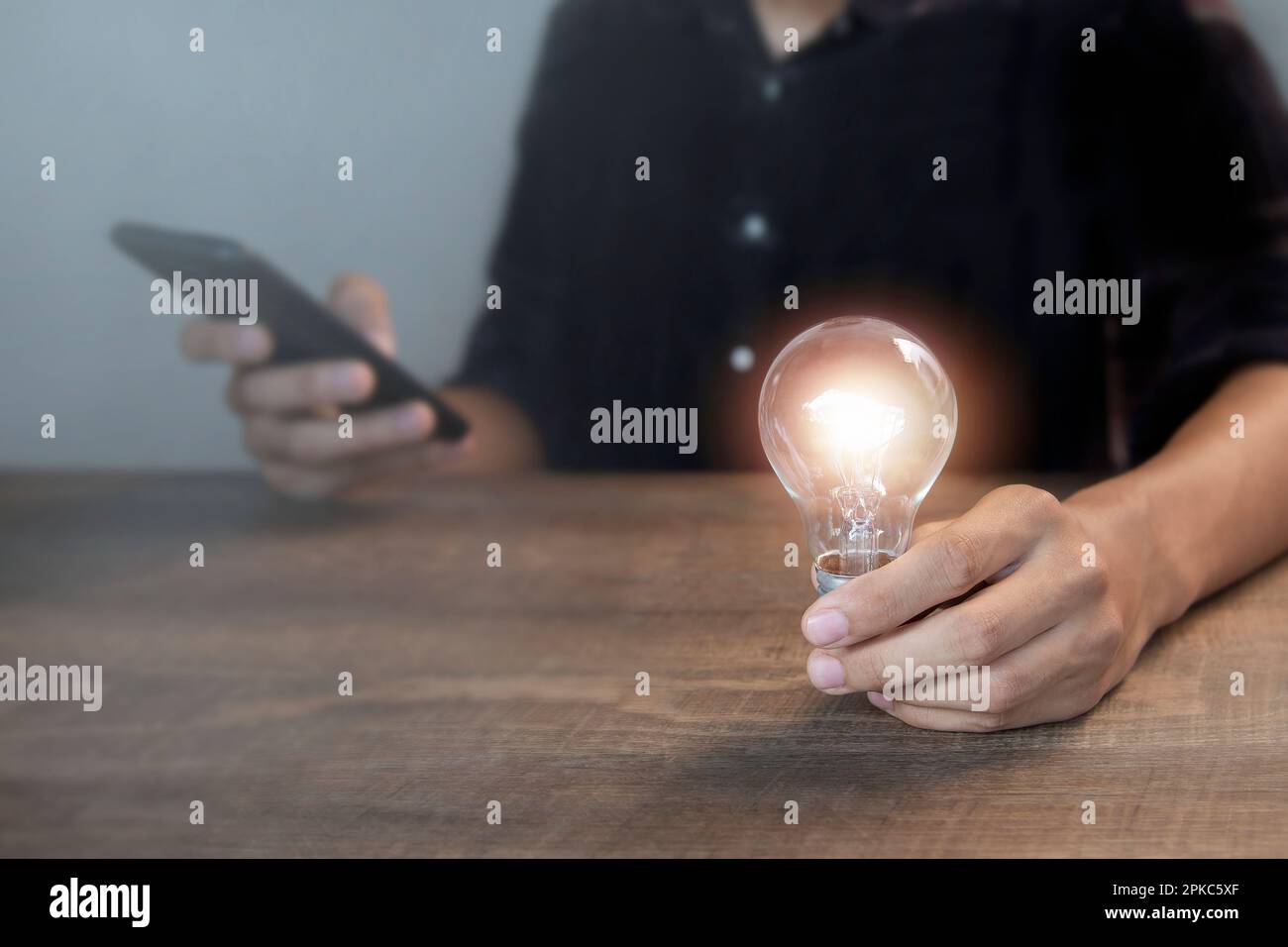 Hand holding a light bulb for innovative and inspirational ideas, technology, science and ...