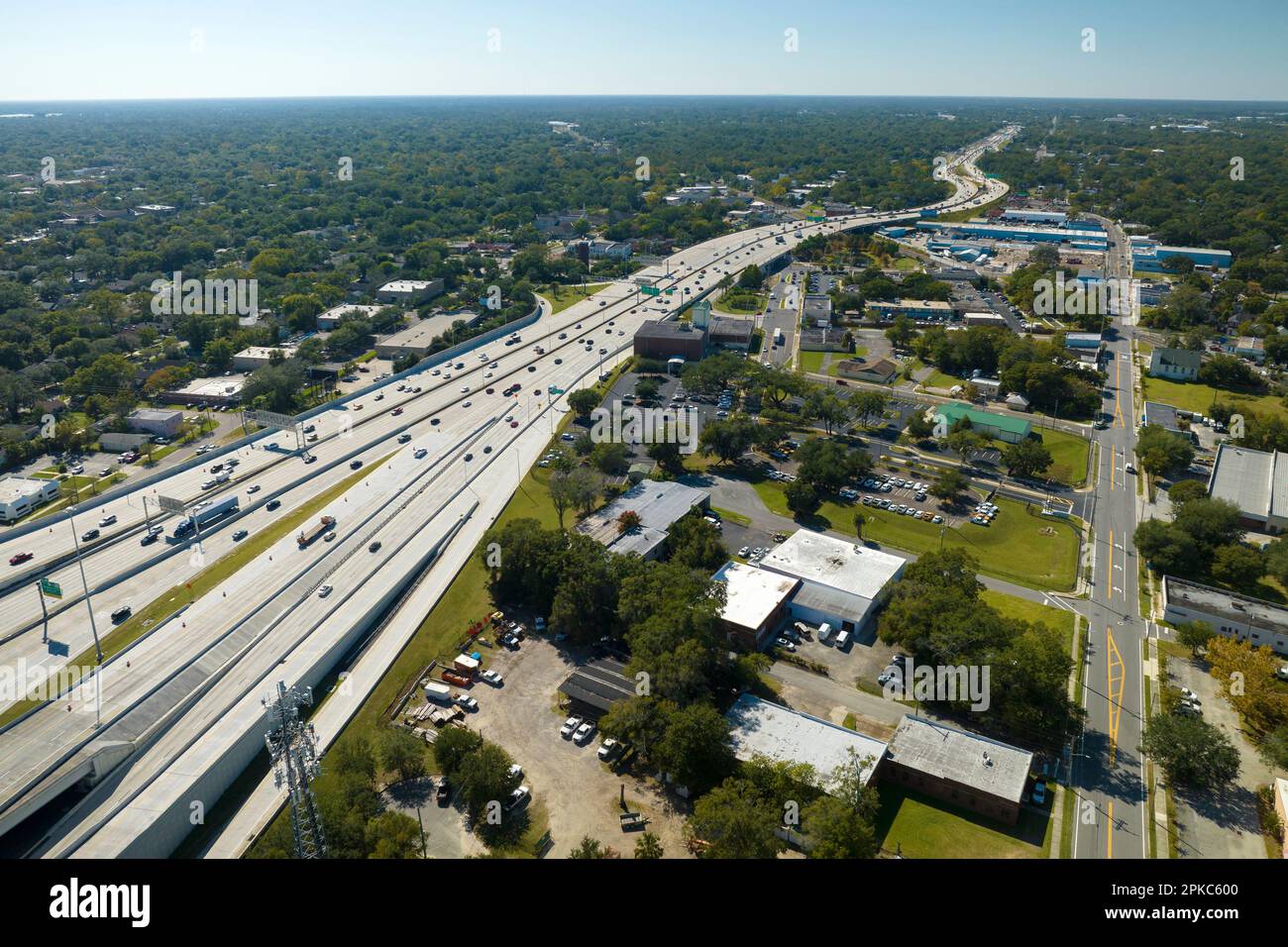 Aerial view of freeway overpass junction with fast moving traffic cars ...
