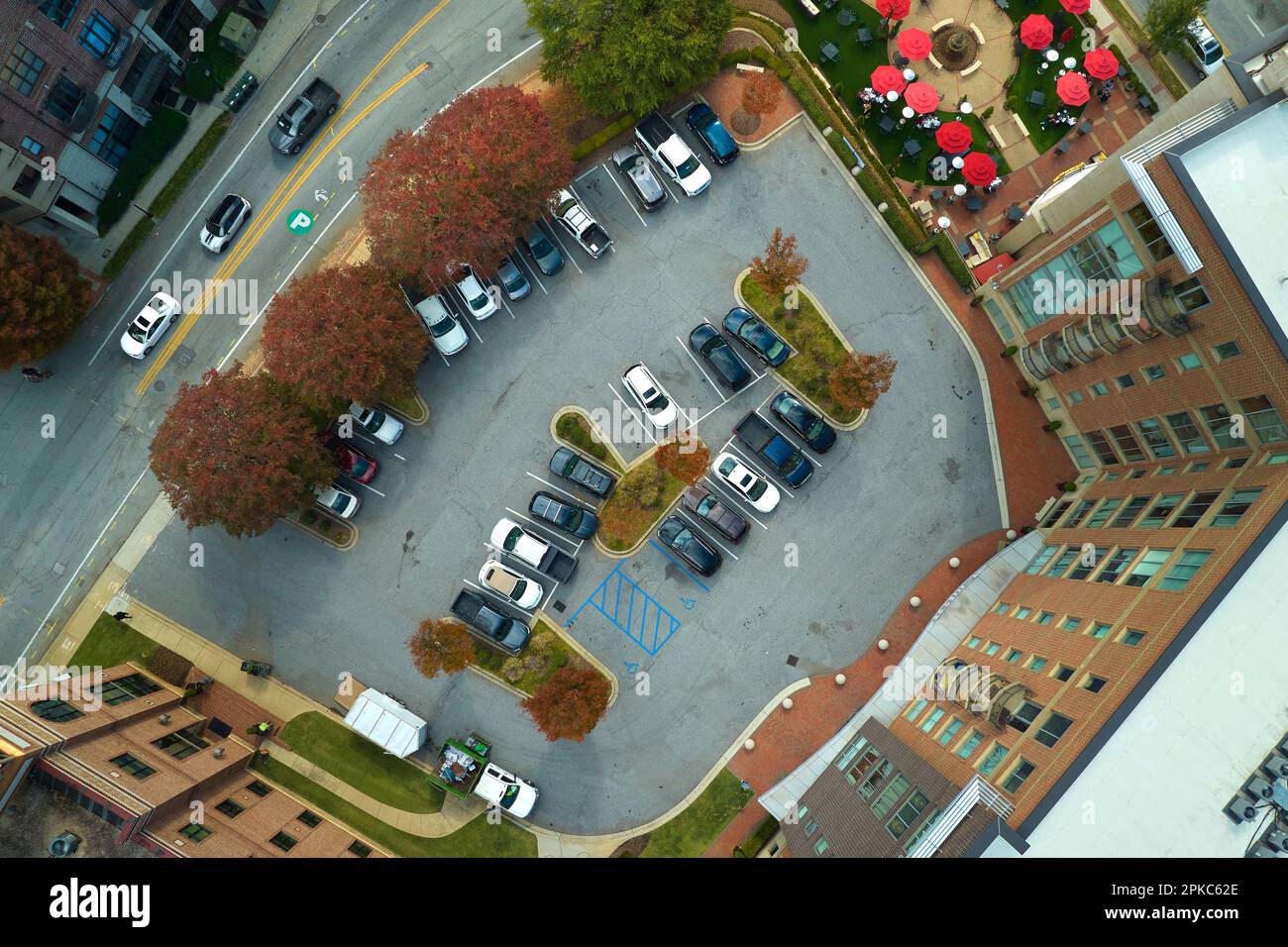 Aerial view of many colorful cars parked on parking lot on apartment ...