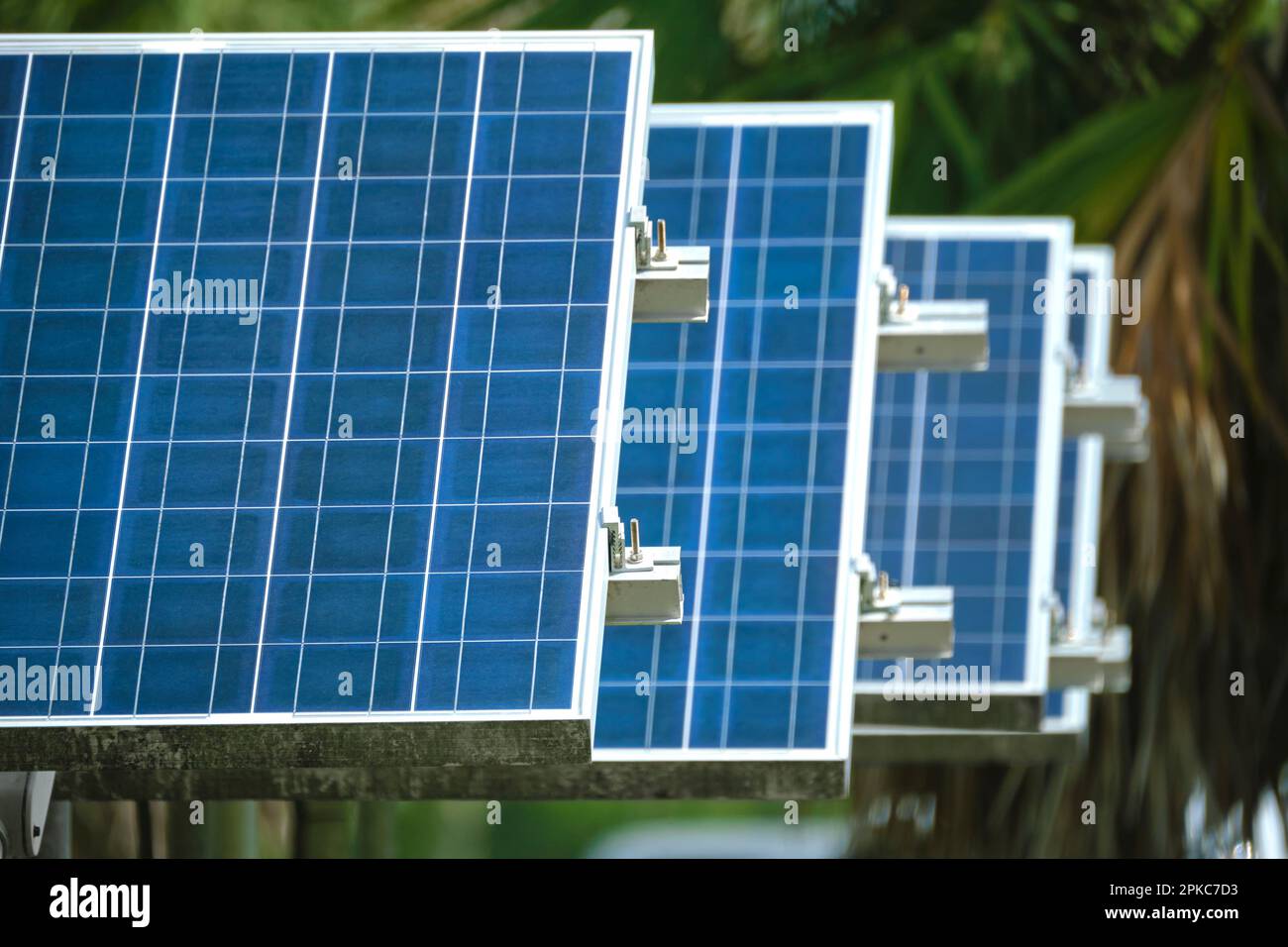 Solar panels installed on stand frame near parking lot for effective ...