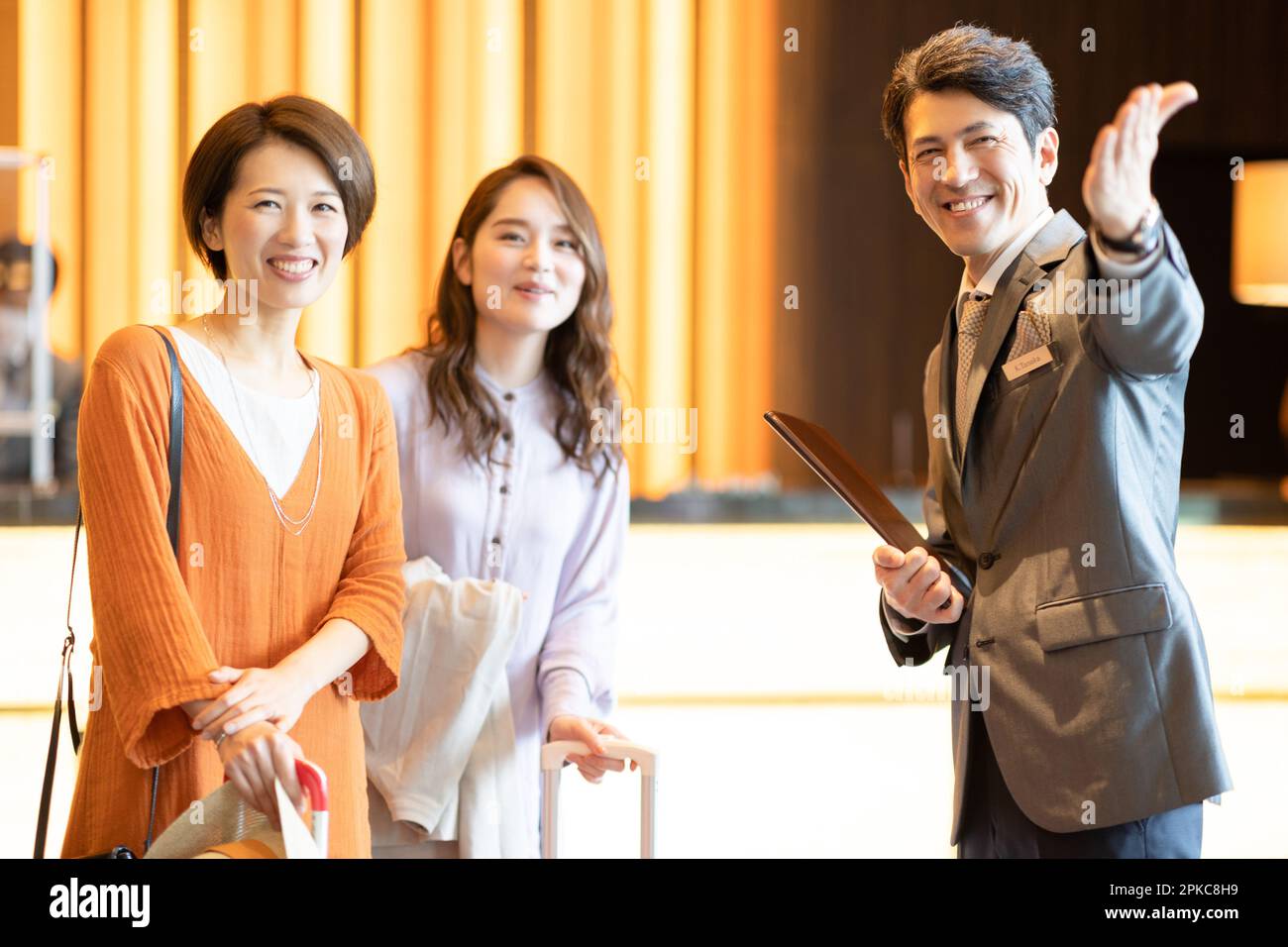 Hotel staff responding to guests Stock Photo - Alamy
