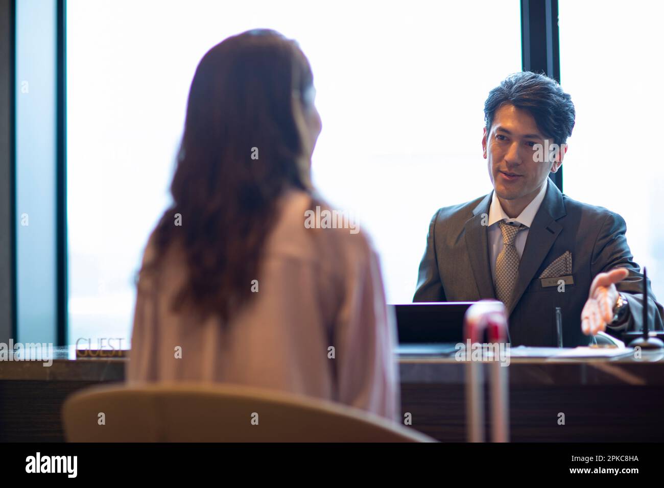 Hotel staff responding to guests Stock Photo - Alamy