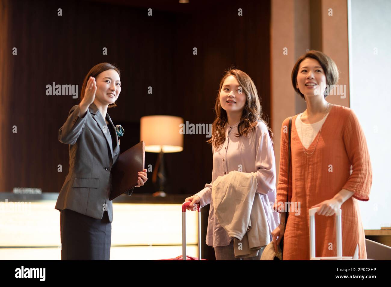 Hotel staff dealing with customers Stock Photo - Alamy