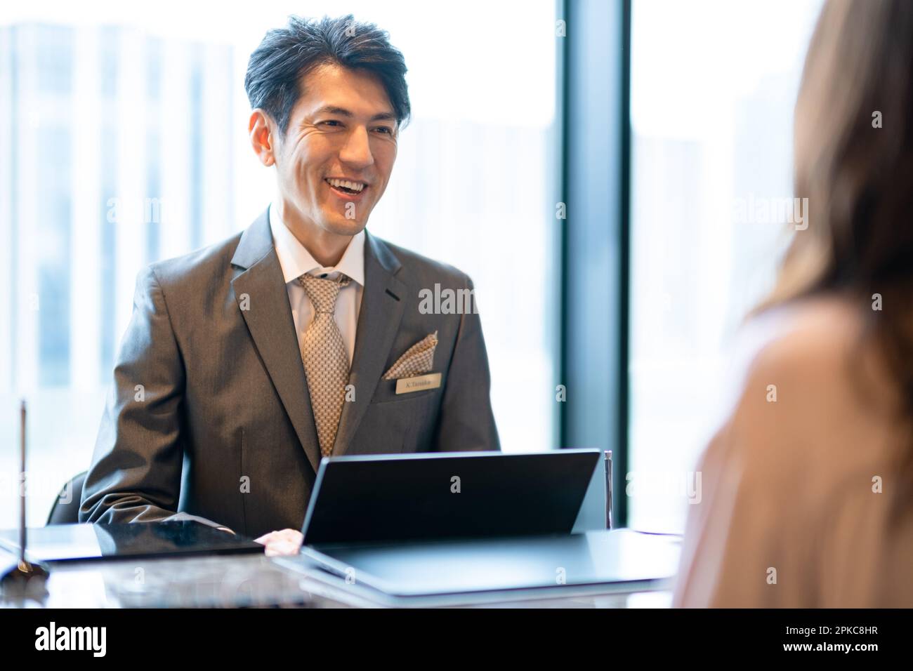 Hotel staff responding to guests Stock Photo - Alamy