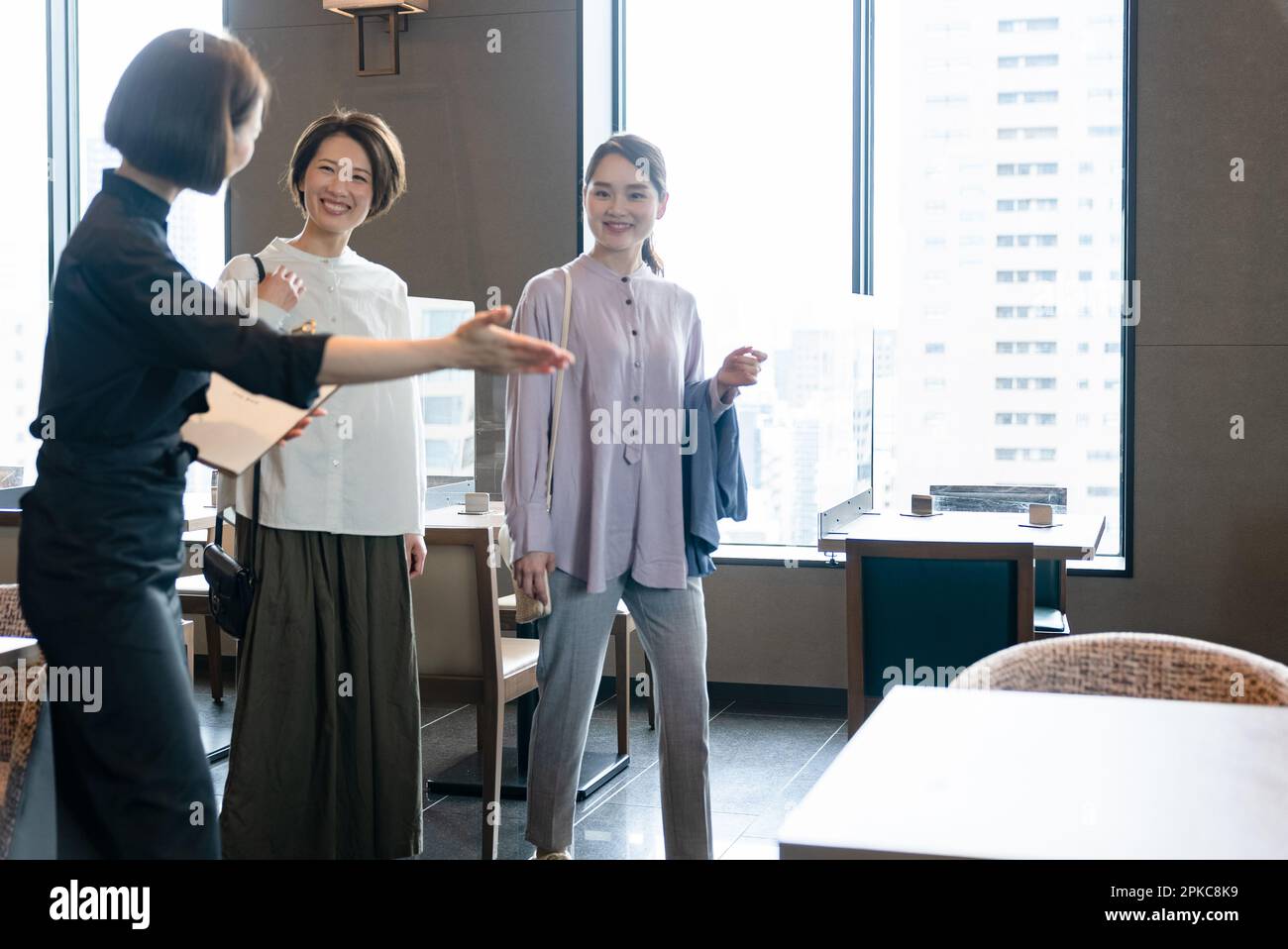 Restaurant staff giving a tour Stock Photo - Alamy