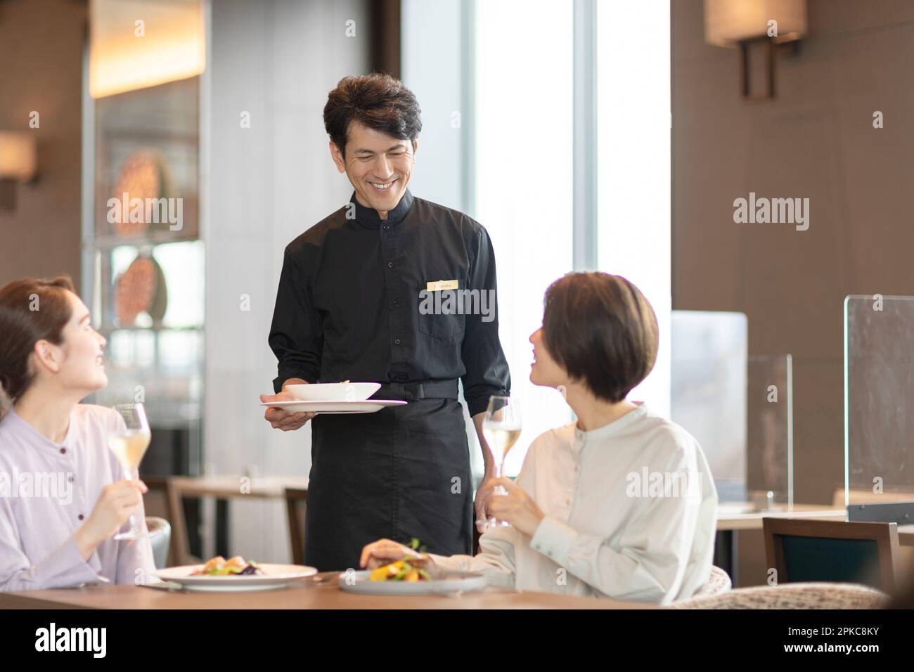 Restaurant staff member hi-res stock photography and images - Alamy