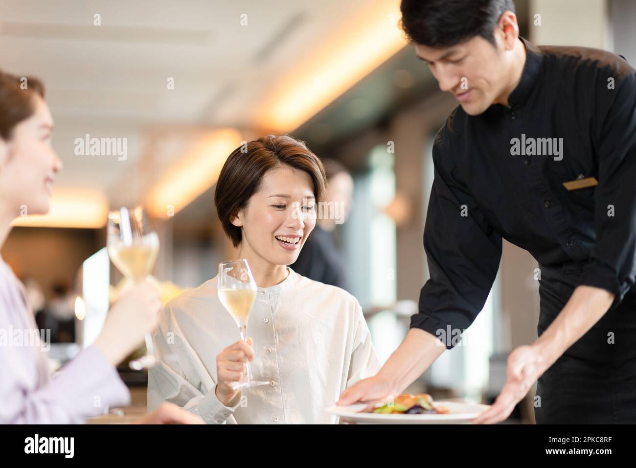 Staff serving a meal Stock Photo - Alamy