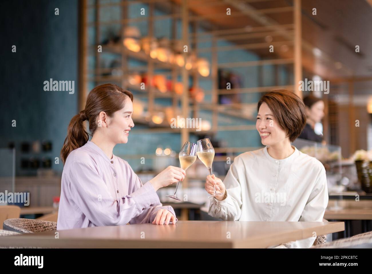 Toasting woman champagne restaurant hi-res stock photography and images ...