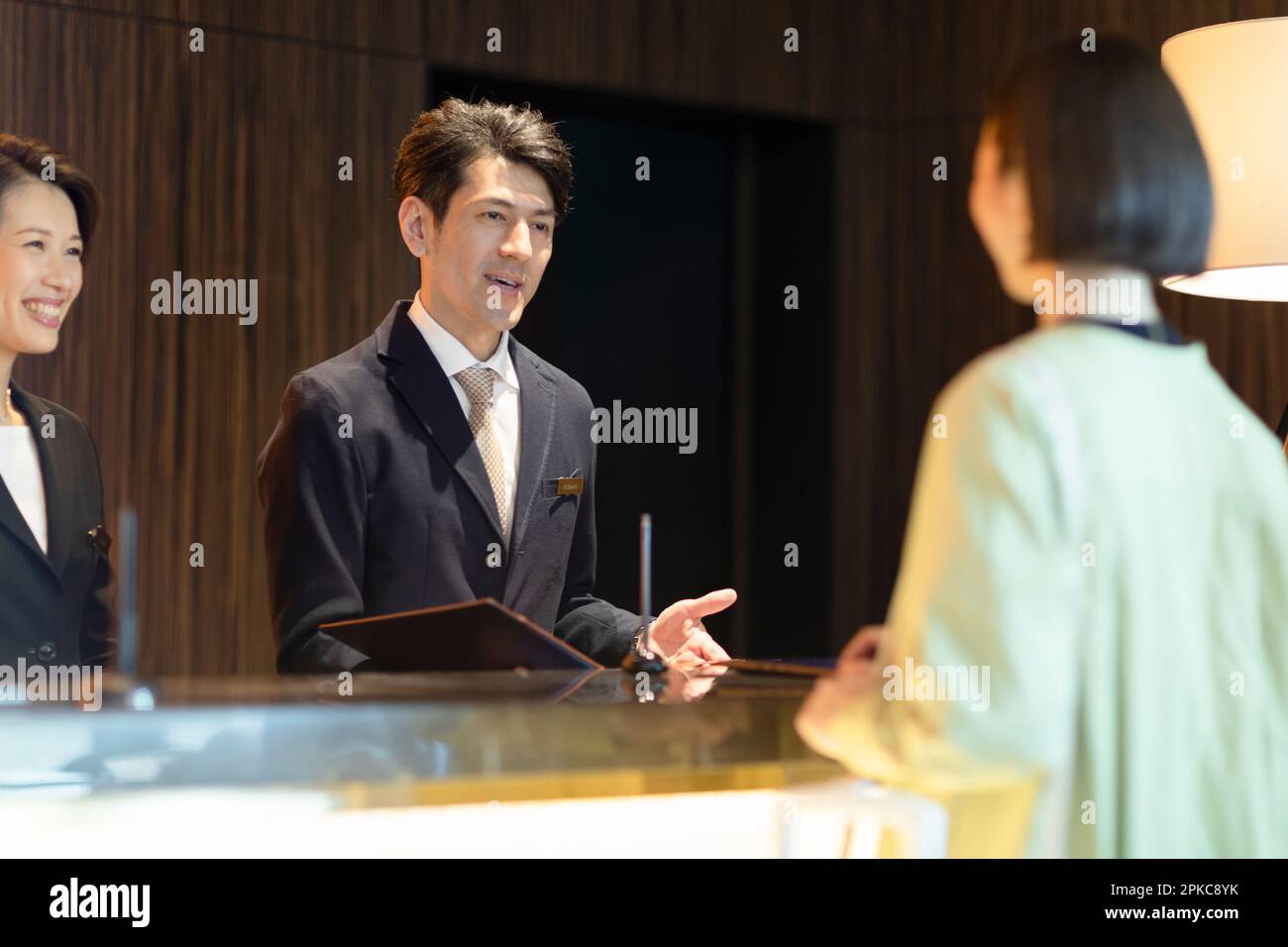 Asian front desk staff hi-res stock photography and images - Alamy