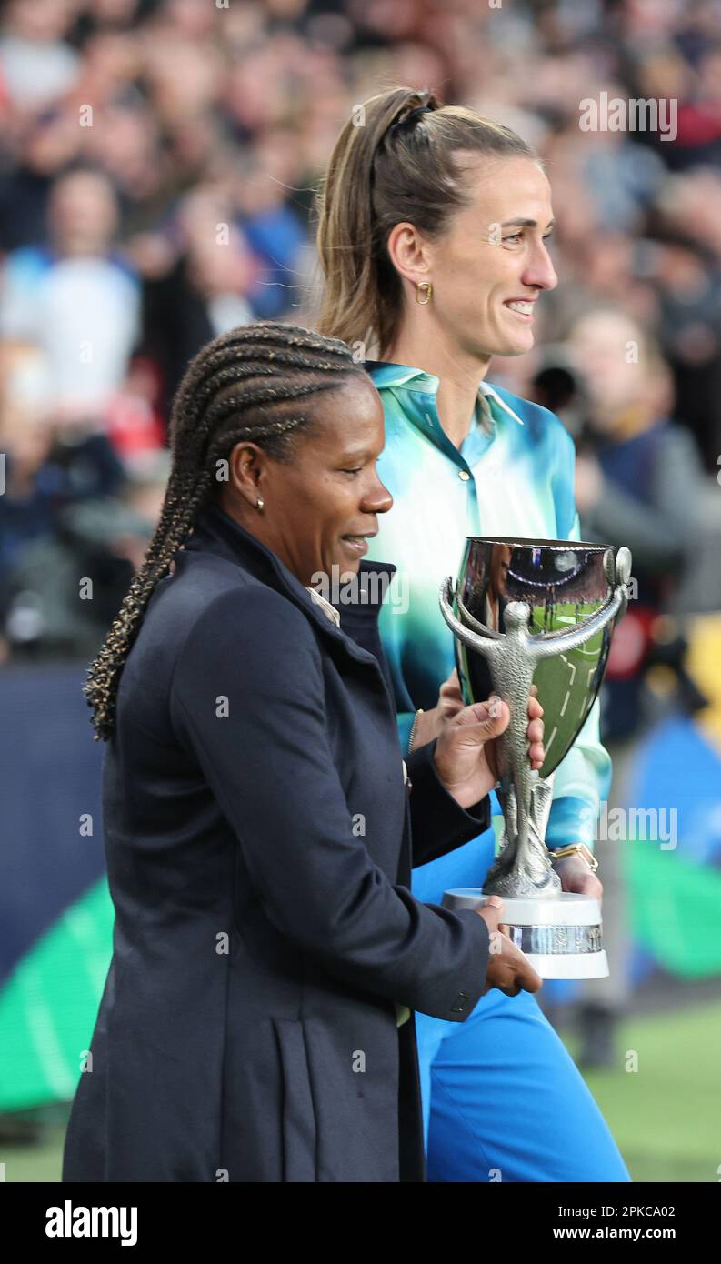 L-R Formiga of Ex Brazil and Jill Scott Ex England bring out the Trophy ...