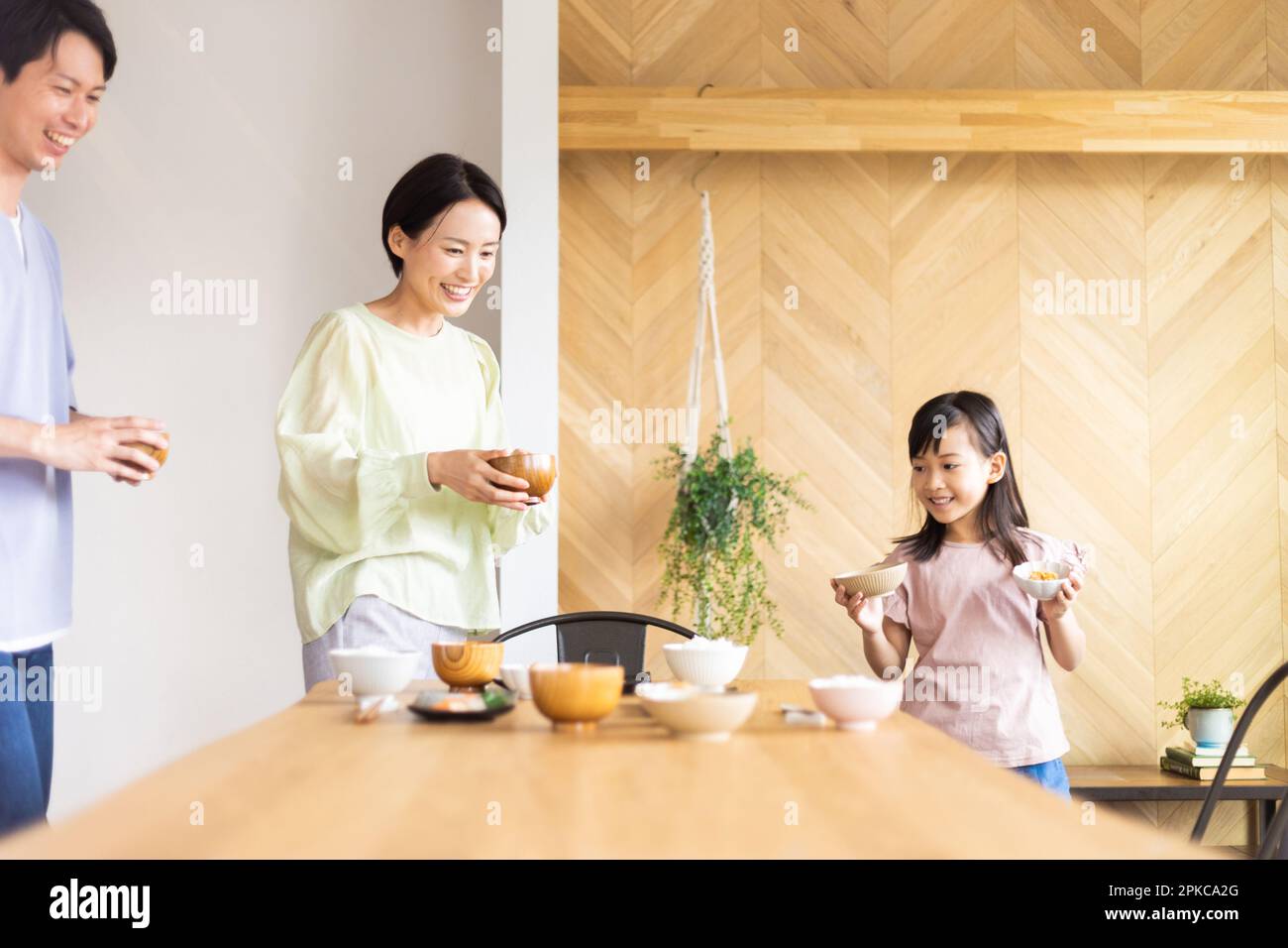 Family bringing food Stock Photo - Alamy