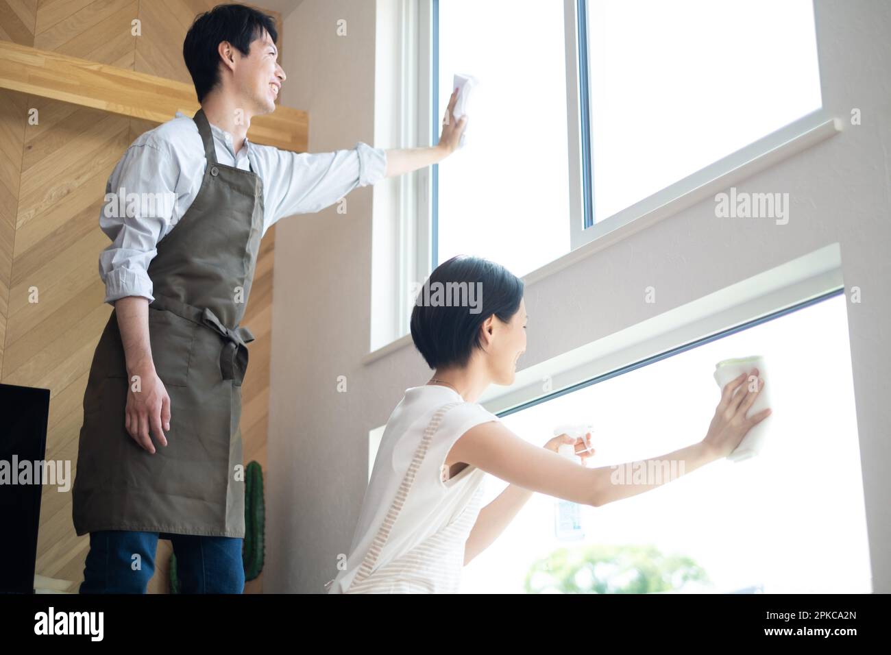 Couple wiping the window Stock Photo - Alamy