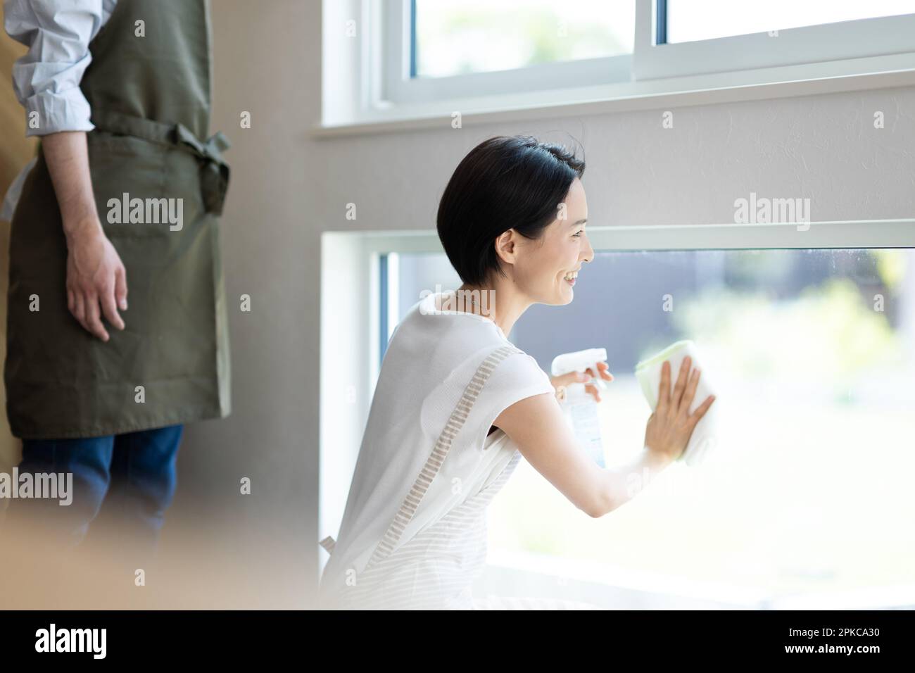 Couple wiping the window Stock Photo - Alamy